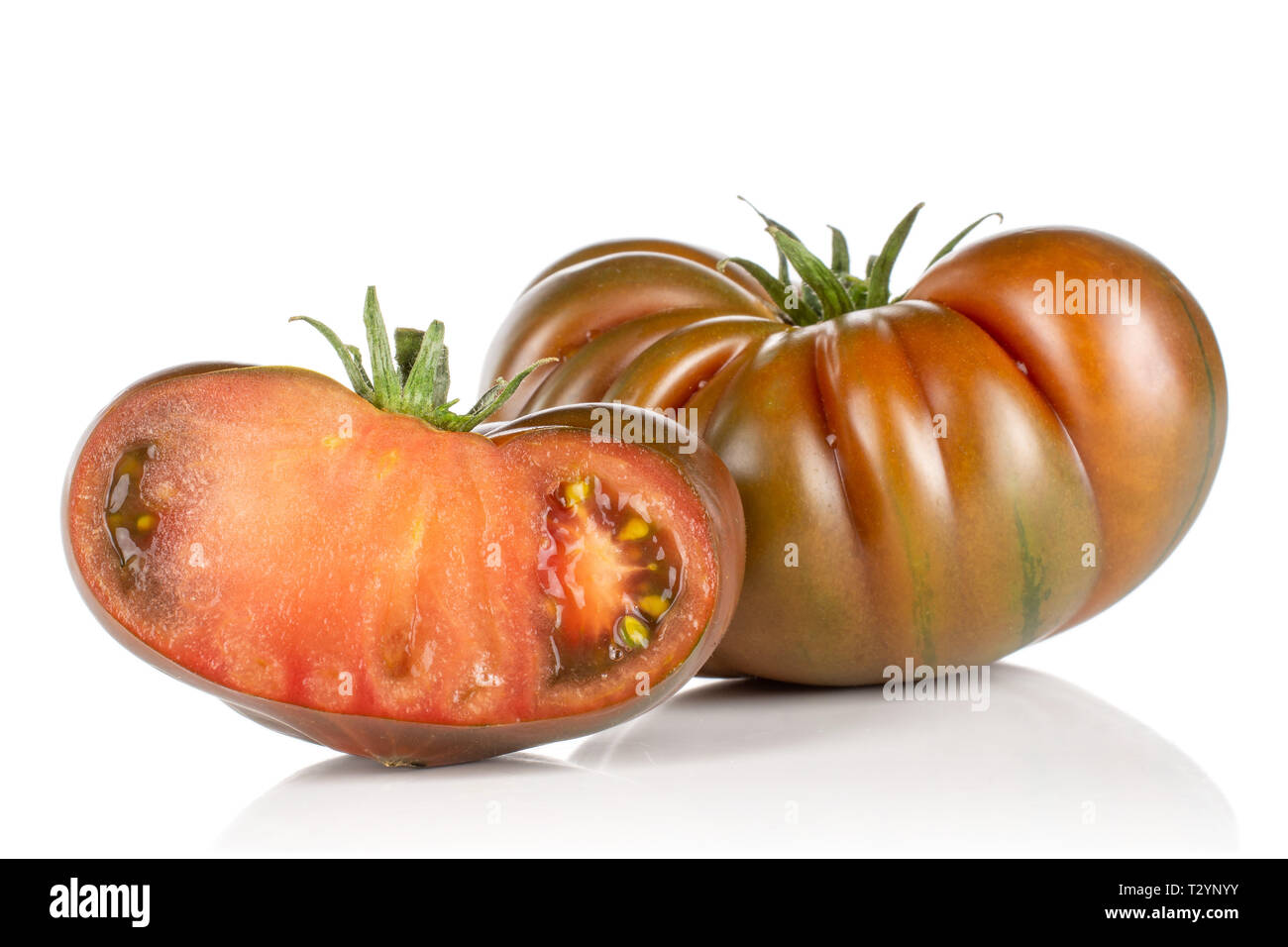 Group of one whole one half of meaty fresh tomato primora isolated on ...