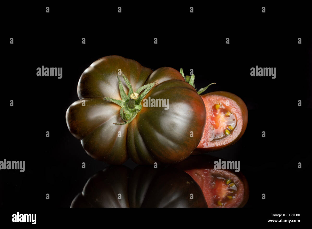 Group of one whole one half of meaty fresh tomato primora isolated on ...