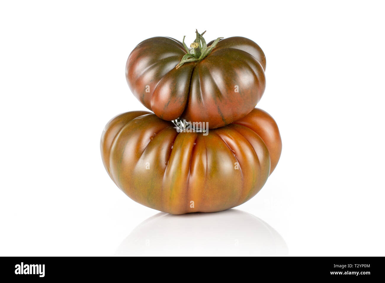 Group of two whole dark fresh tomato primora isolated on white ...