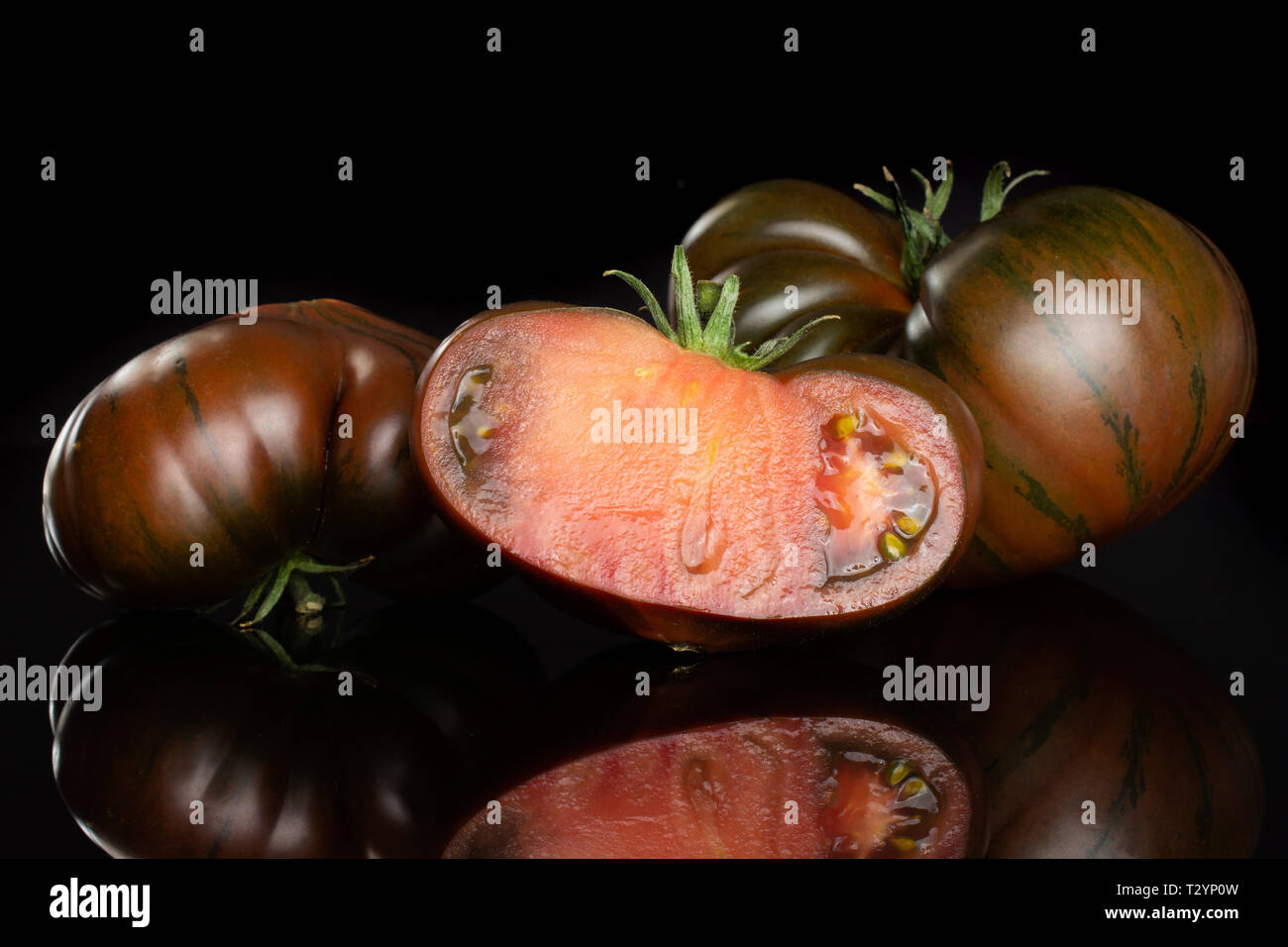 Group of two whole one half of meaty fresh tomato primora isolated on ...