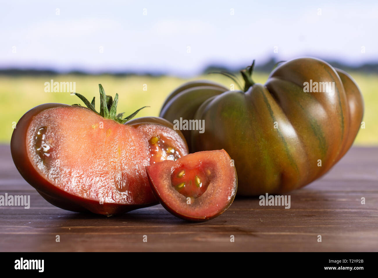 Group of one whole one half one slice of fresh tomato primora with ...