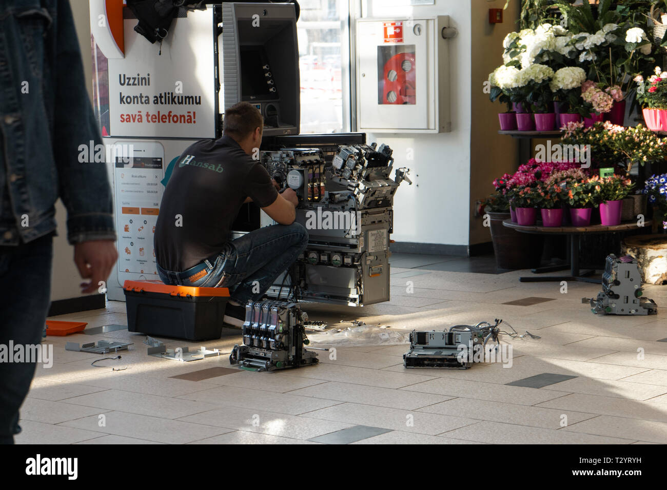 Broken ATM machine is being repaired - Bank are in a shopping centre ...