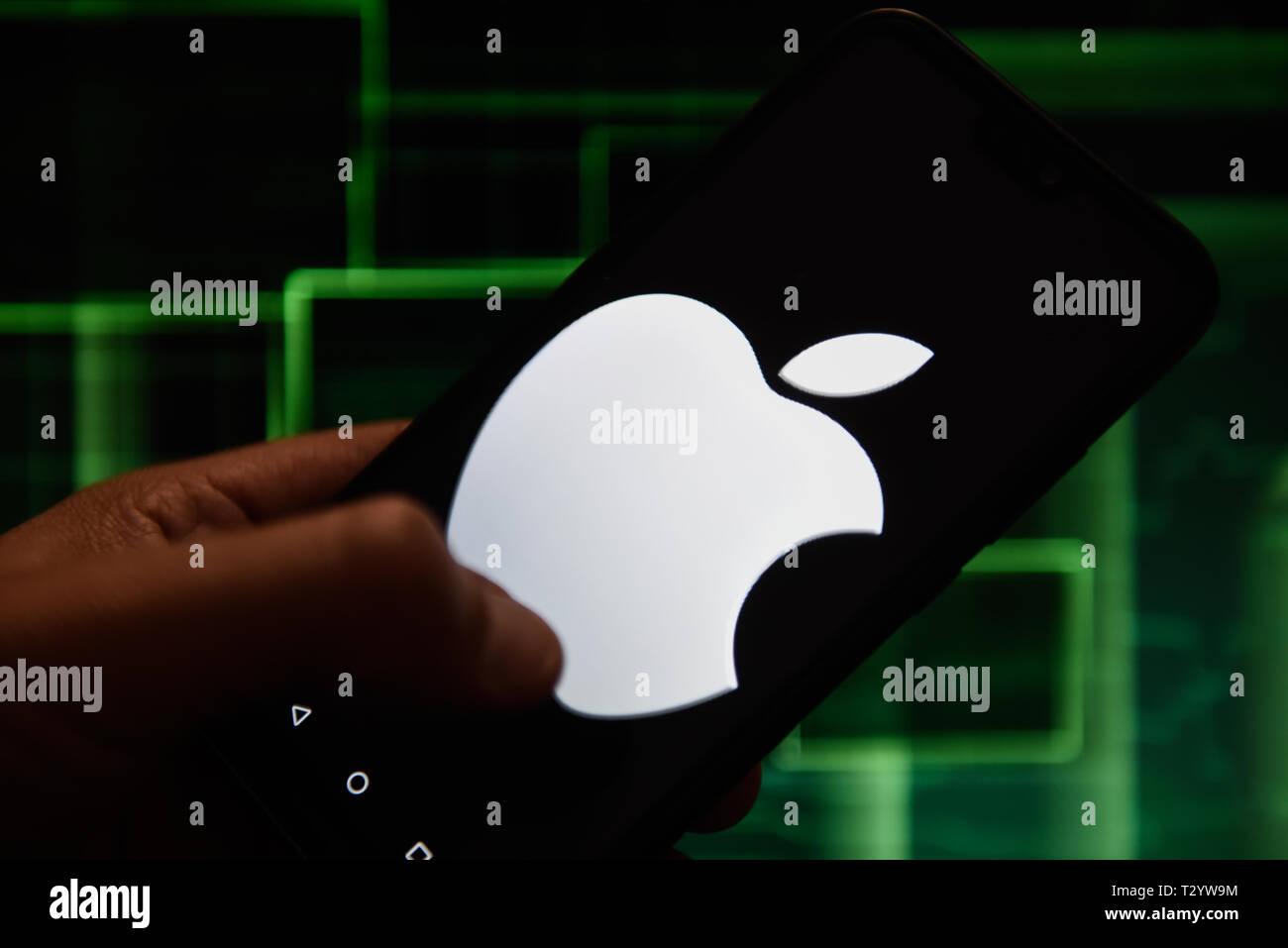 In this photo illustration an Apple logo seen displayed on a smart ...
