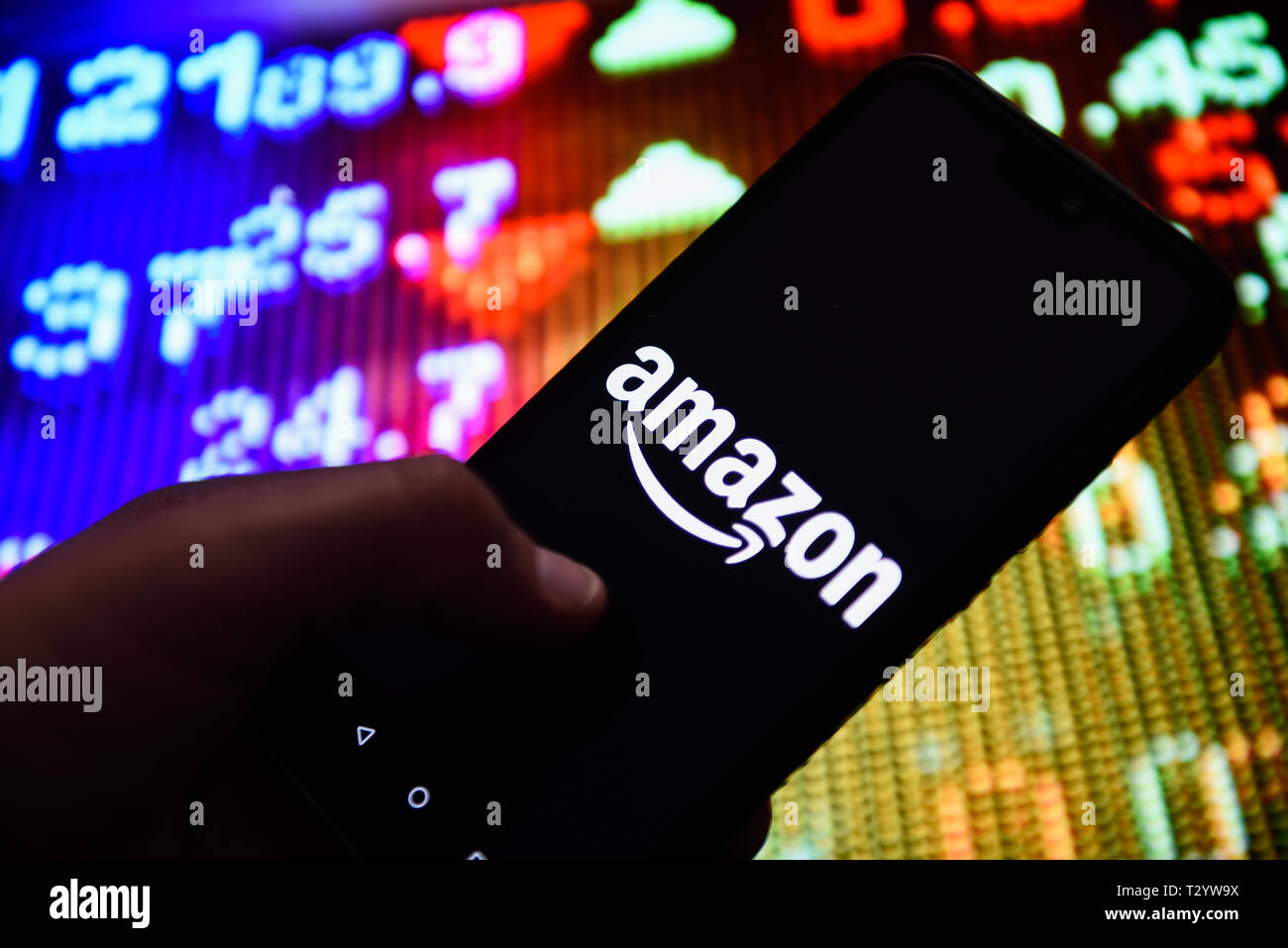 In this photo illustration an Amazon logo seen displayed on a smart ...