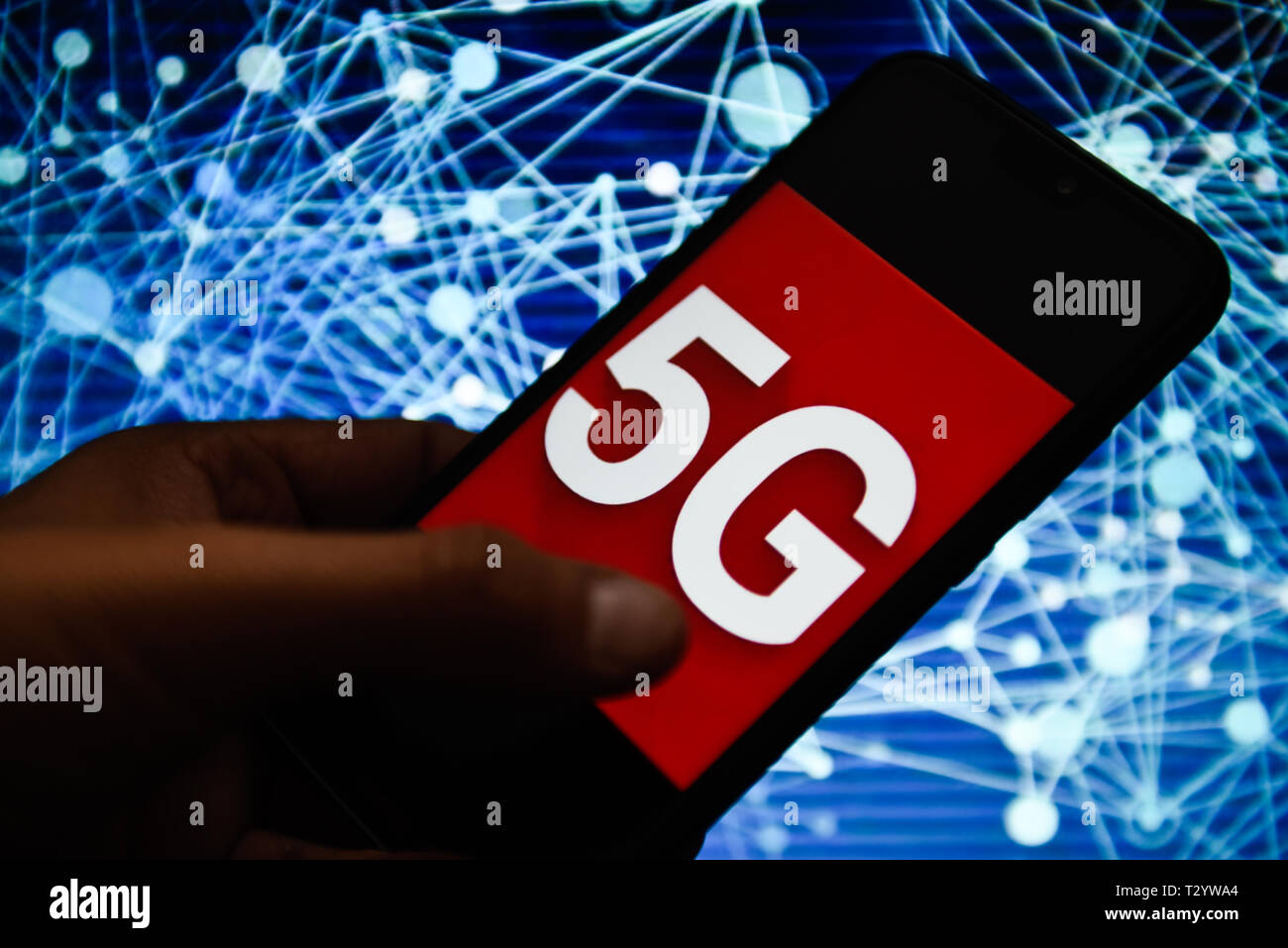 In this photo illustration a 5G logo seen displayed on a smart phone ...