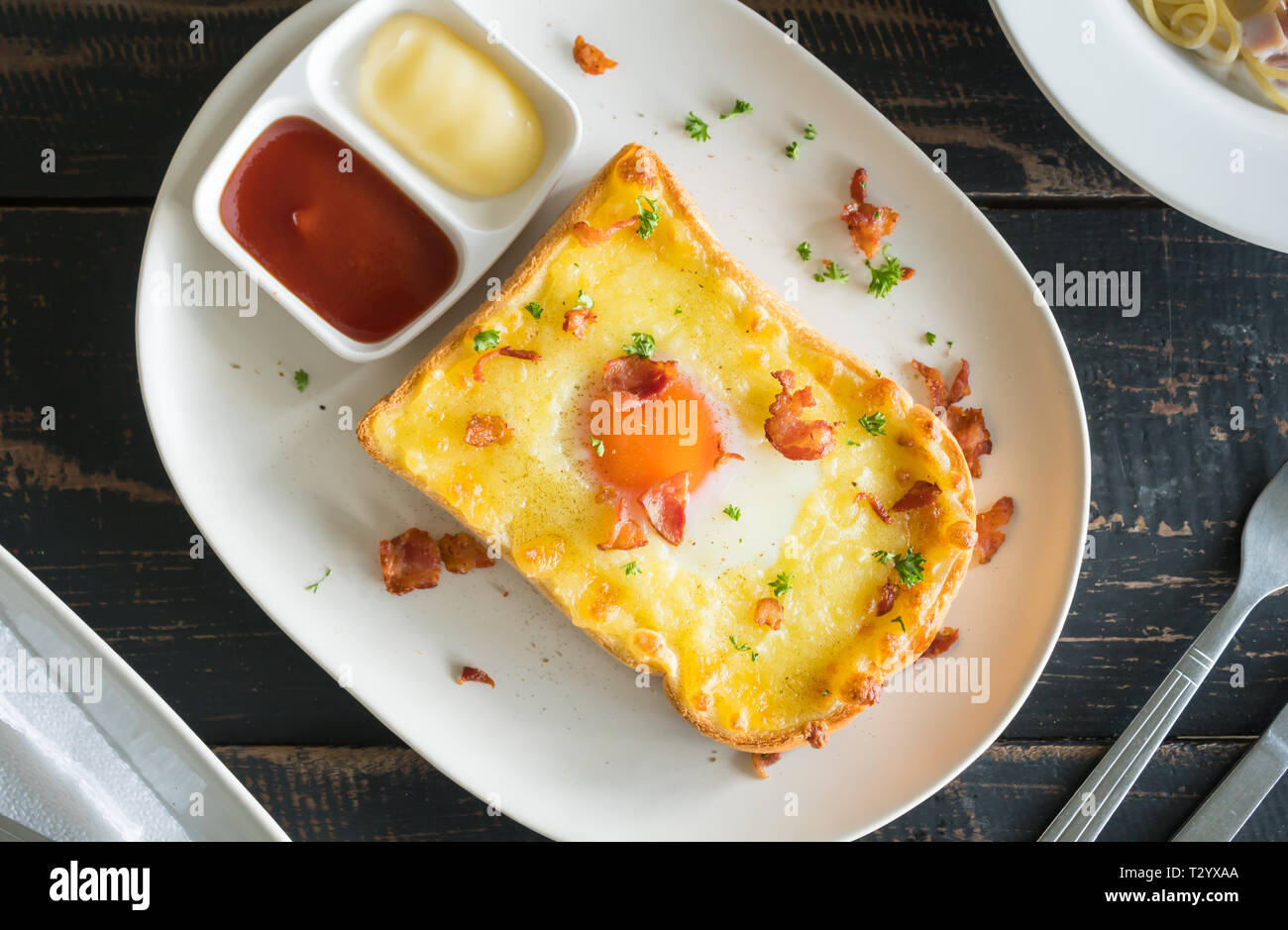 Egg Yolk Bacon Ham Cheese Toast and Coriander. Breakfast egg yolk bacon ...