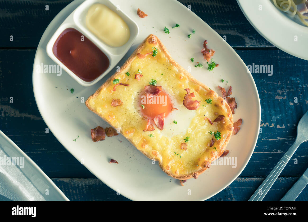 Egg Yolk Bacon Ham Cheese Toast and Coriander. Breakfast egg yolk bacon ...