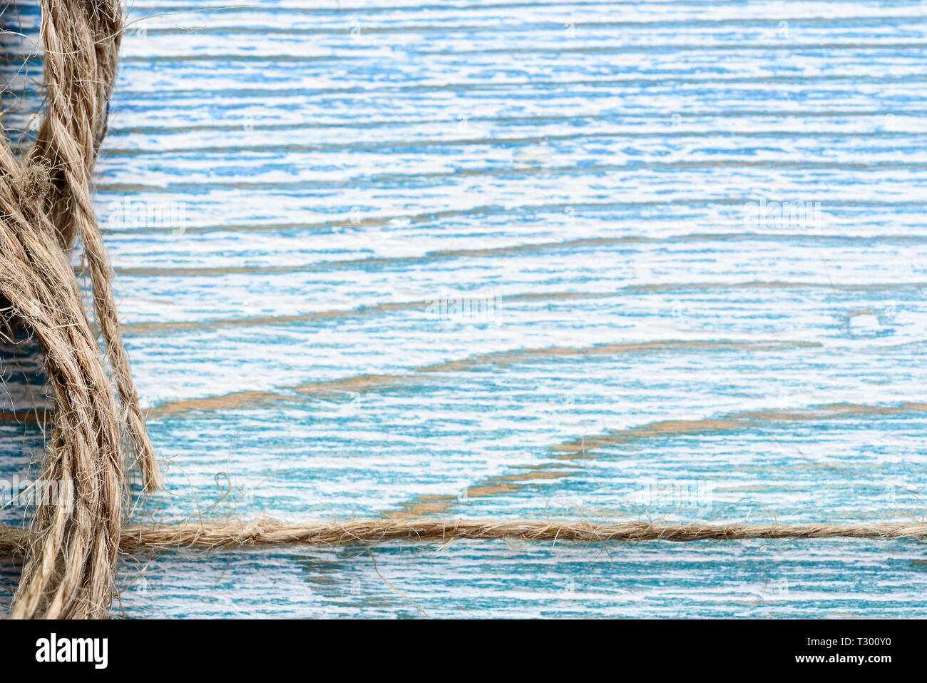 Frame on a wooden background of jute twine Stock Photo - Alamy