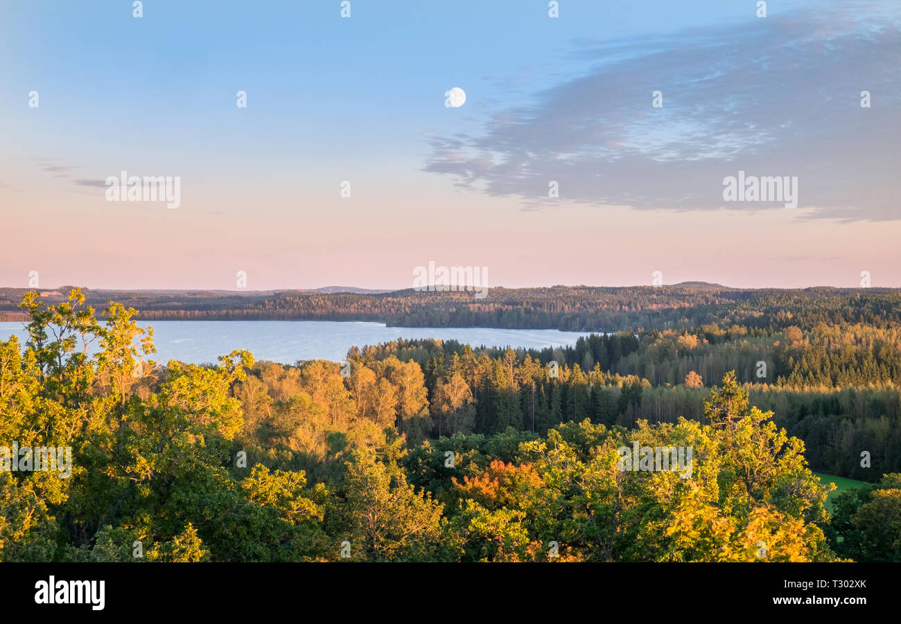 Scenic landscape with lake and sunset at evening in nature reserve ...