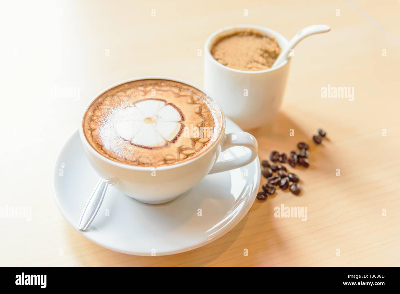 Take the hot cappuccino with nice milk pattern with coffee bean Stock ...