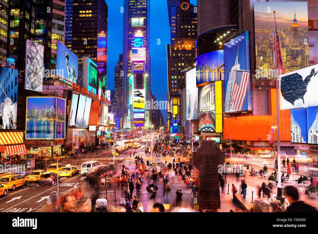 New York Icons in Times Square at dusk Stock Photo - Alamy
