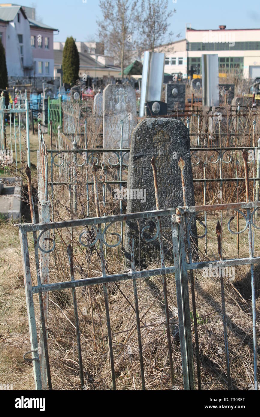 ancient public city cemetery with traditional europen headstones on ...
