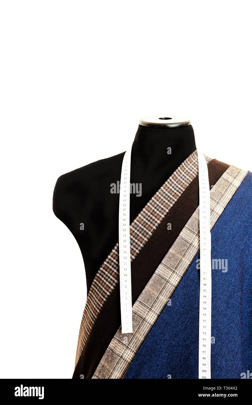 Many different in color threads lie on the layman-figure with the ...