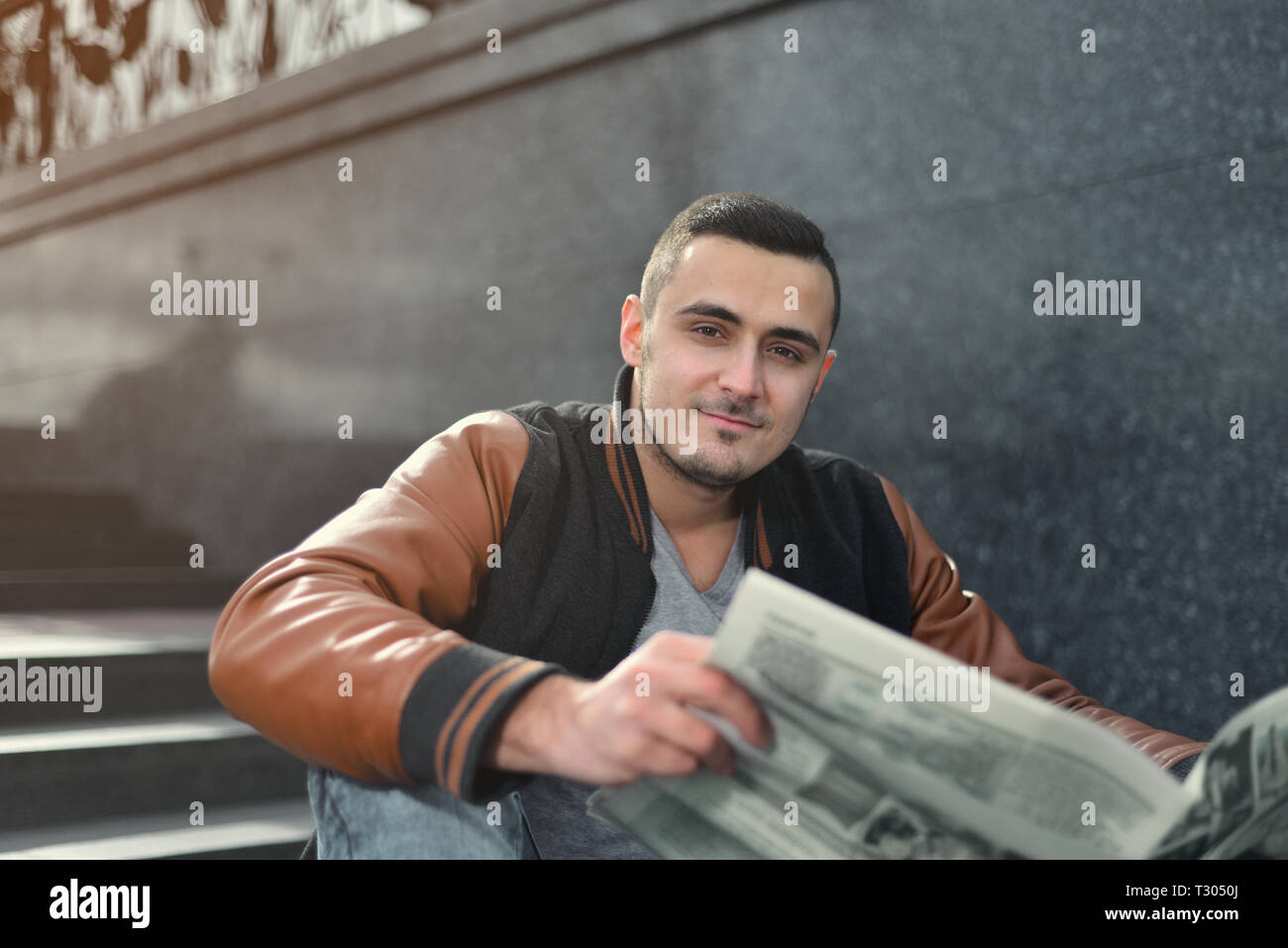 Man reading paper on bench hi-res stock photography and images - Alamy