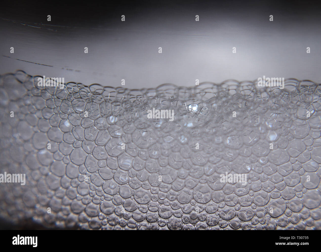 White bubble foam side view Stock Photo - Alamy