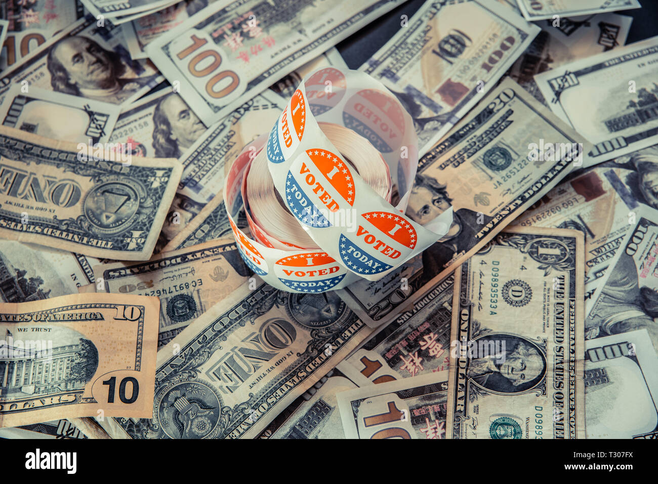 I vote Today stickers on a pile of American dollar bills, political ...
