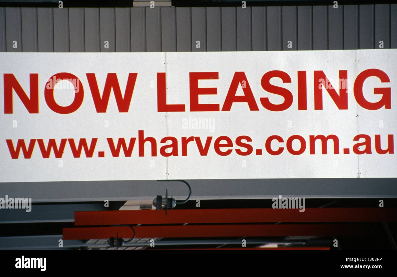 PROPERTY SIGN 'NOW LEASING' AND WEBSITE ADDRESS OF COMPANY Stock Photo ...