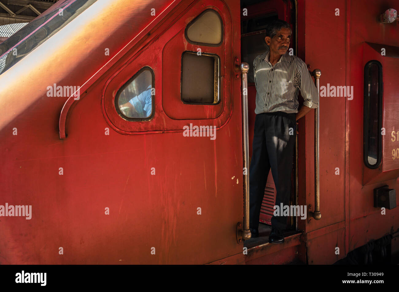 Man standing on a train, Colombo, Sri Lanka Stock Photo - Alamy