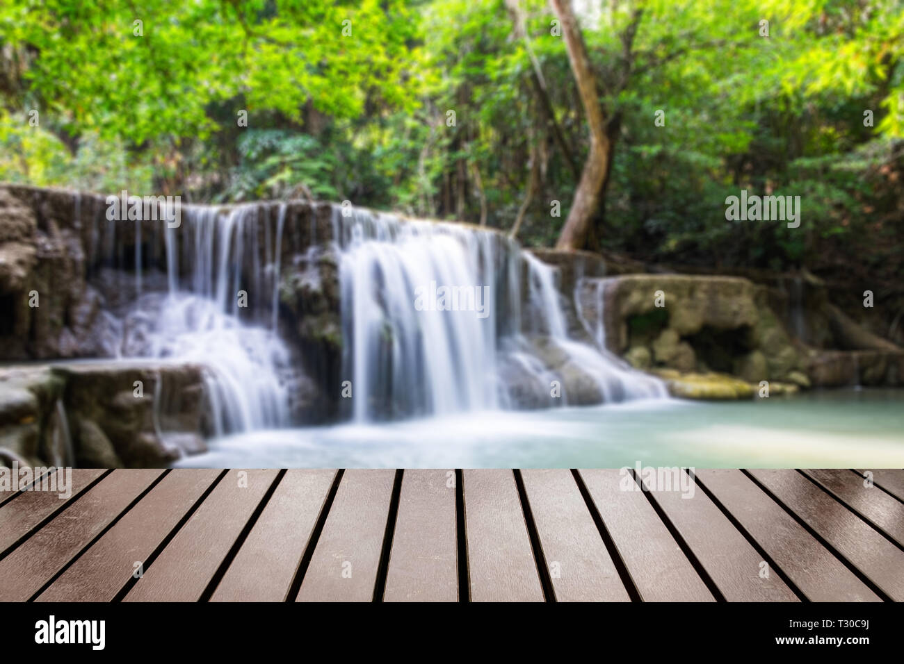 Wood table top on blurred waterfall tropical rain forest Stock Photo ...