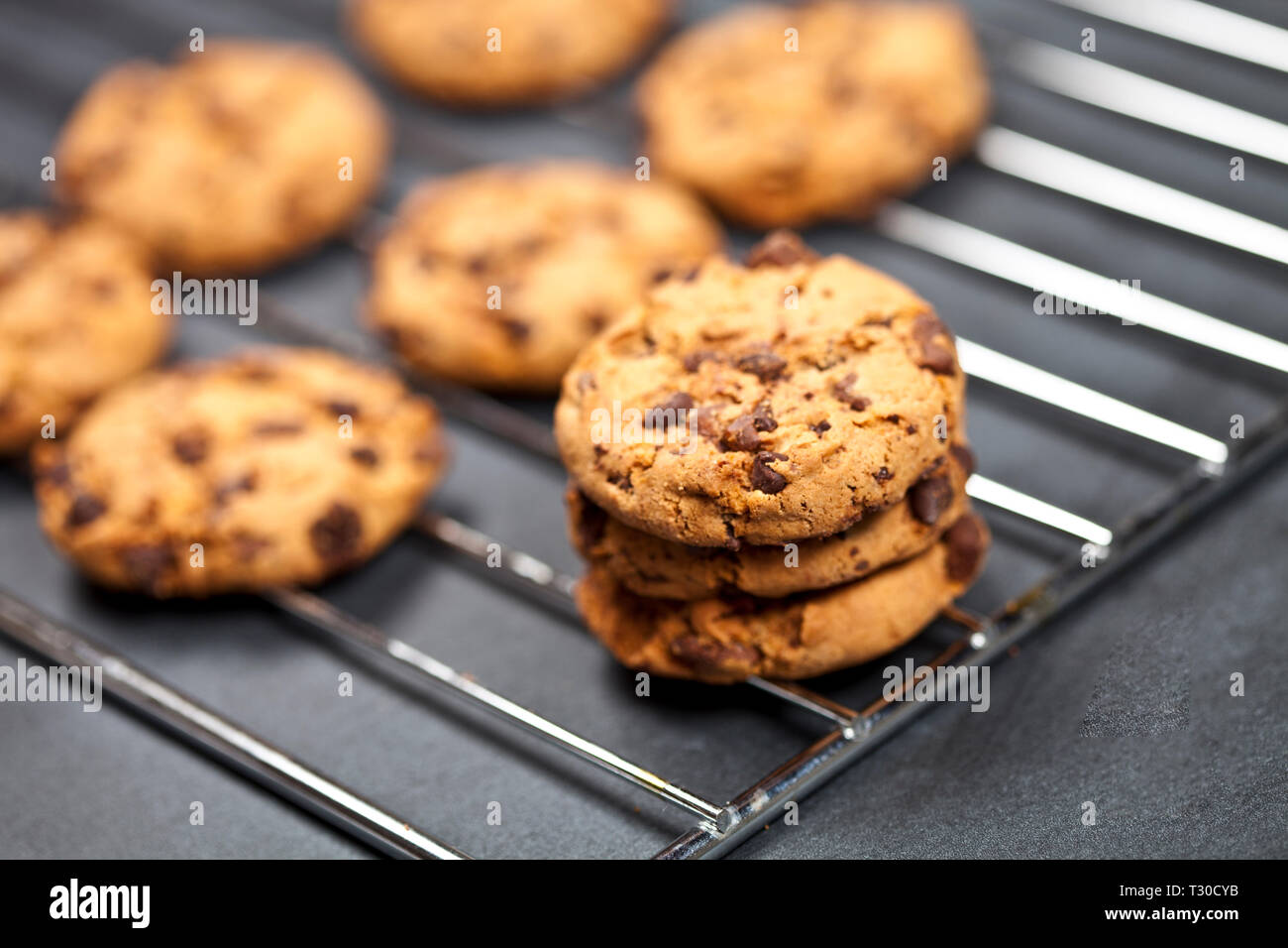 Baking grid with chokolate cookies on blackboard background Stock Photo ...