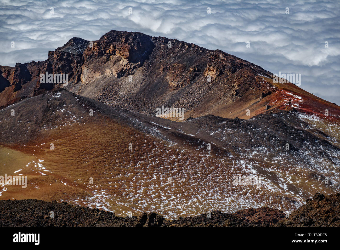 Aerial view of volcanic crater over the clouds Stock Photo - Alamy