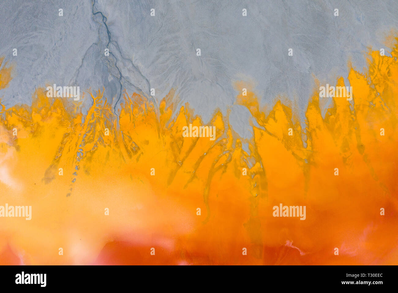 Colorful lake polluted with yellow waste water, aerial view of a mining ...