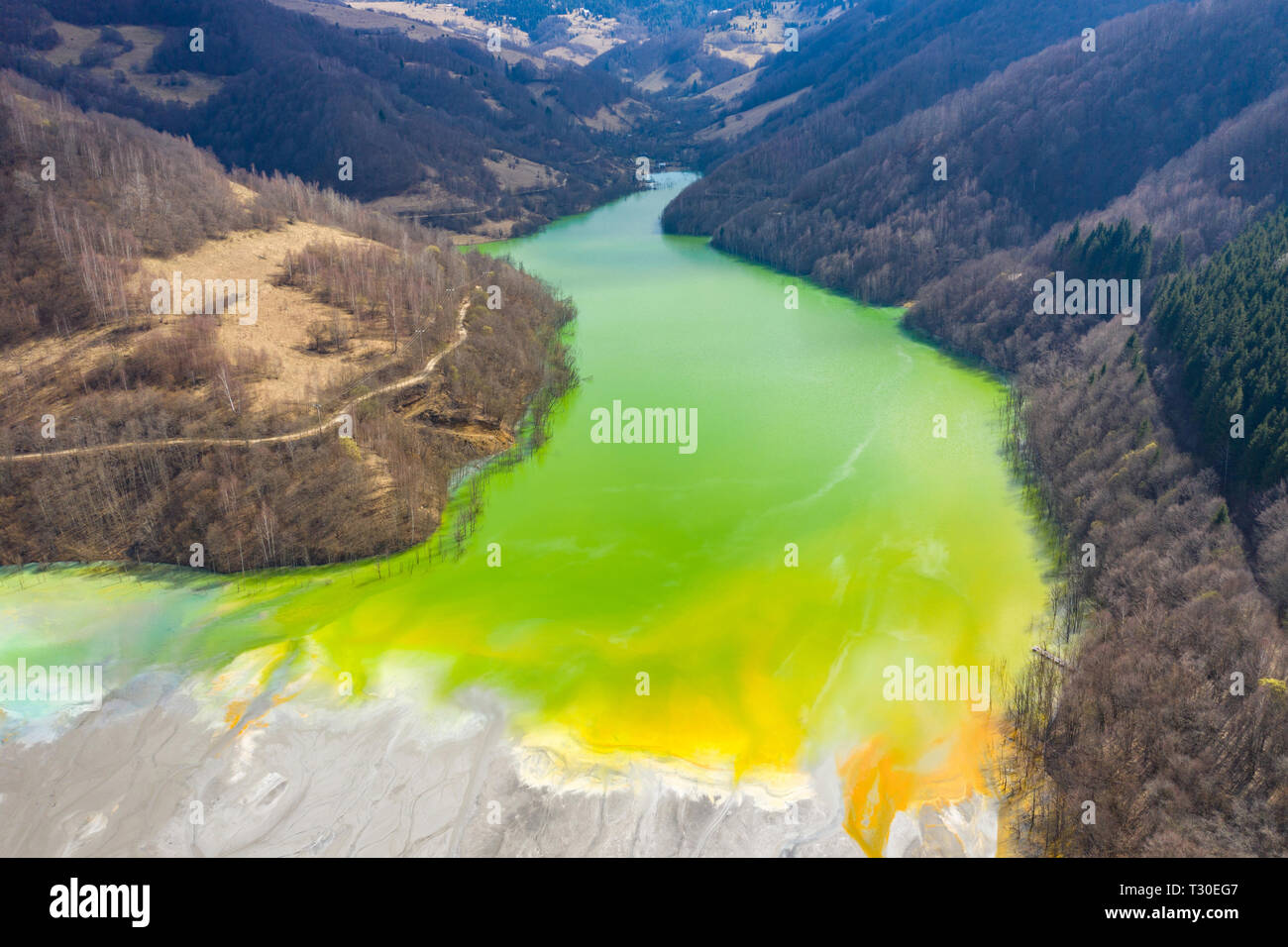 Aerial drone view of toxic chemical residuals flooding a lake from a ...