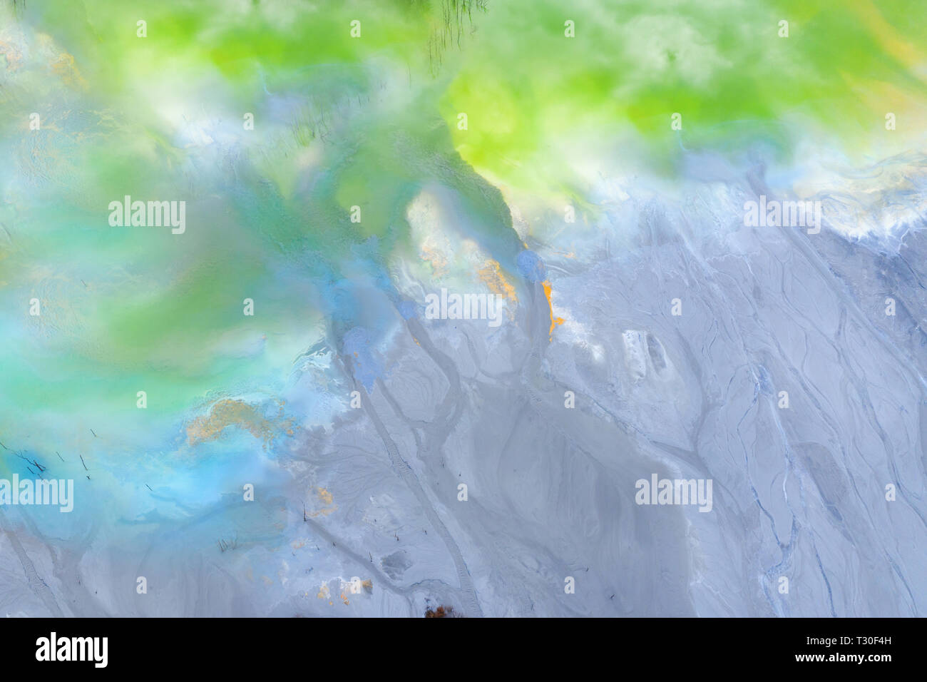 Aerial drone view of toxic chemical residuals flooding a lake from a ...