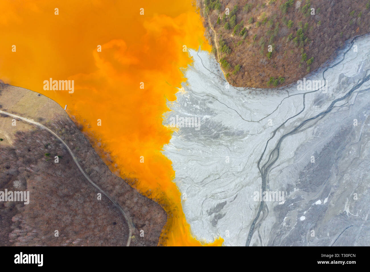 Aerial drone view of water pollution of a copper mine exploitation ...