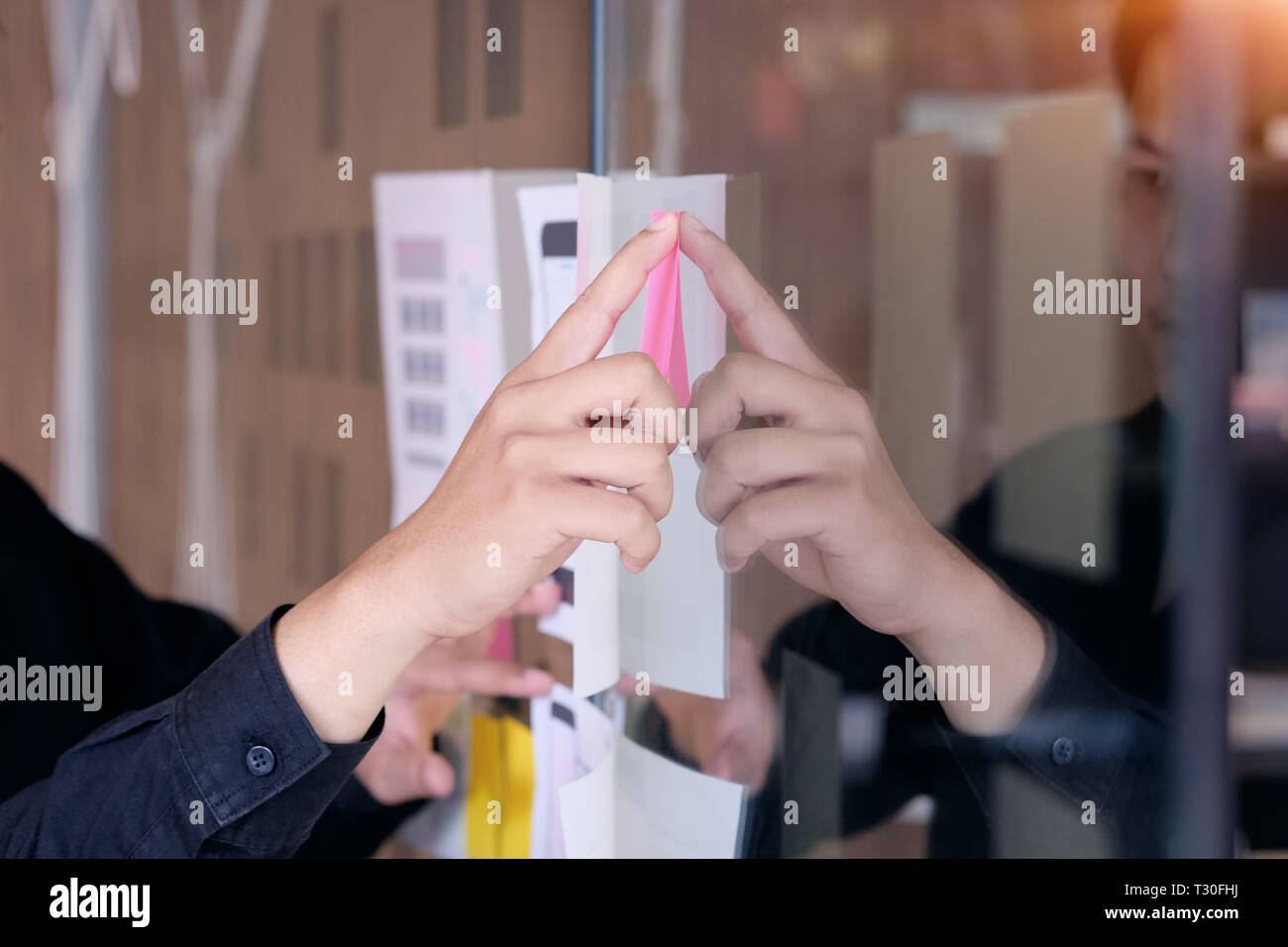 Hand touch sticky note hi-res stock photography and images - Alamy