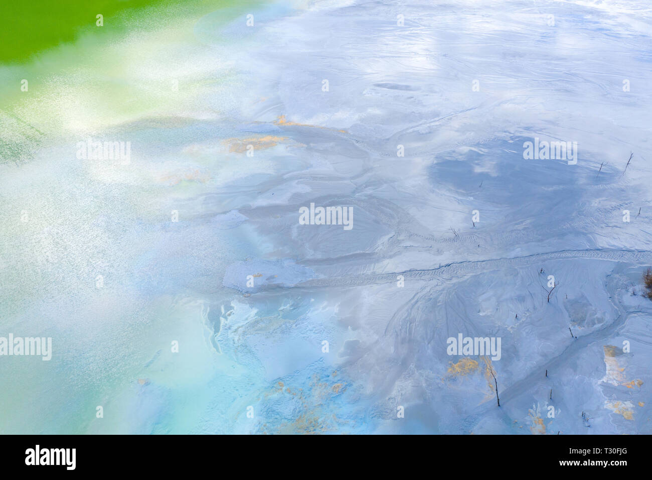 Aerial drone view of toxic chemical residuals flooding a lake from a ...
