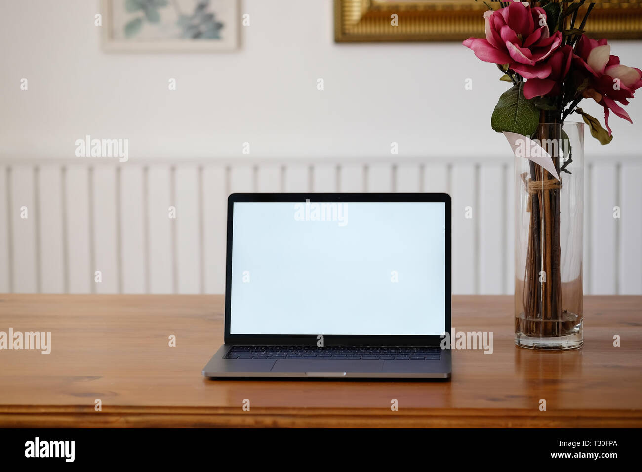 Mockup laptop computer and rose flower on wooden office desk Stock ...