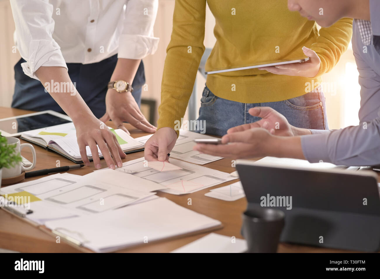 UX UI concept,A team developer working with digital tablet and paper ...