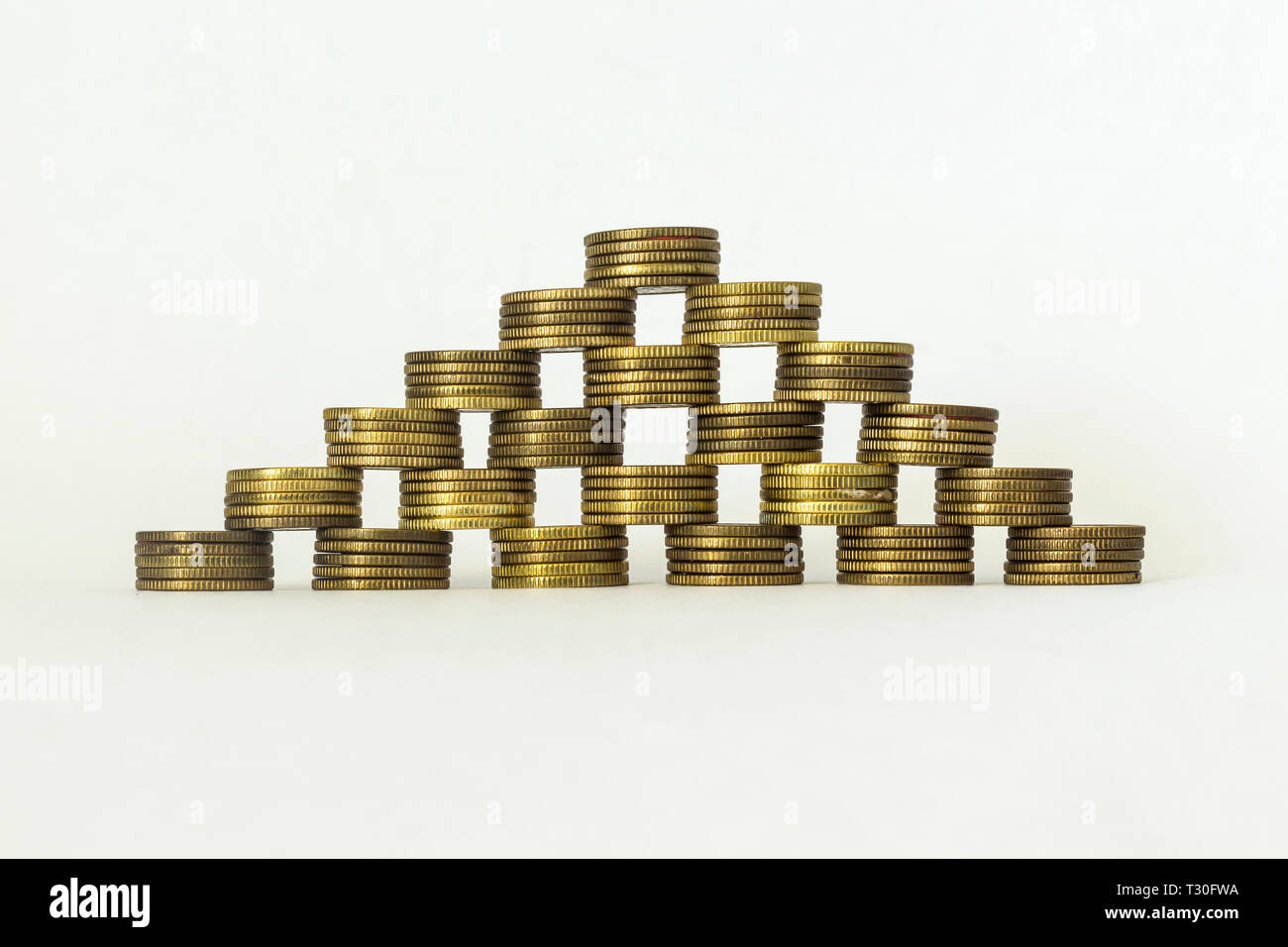 Stacks of copper coins on a white background. The stacks look like a ...