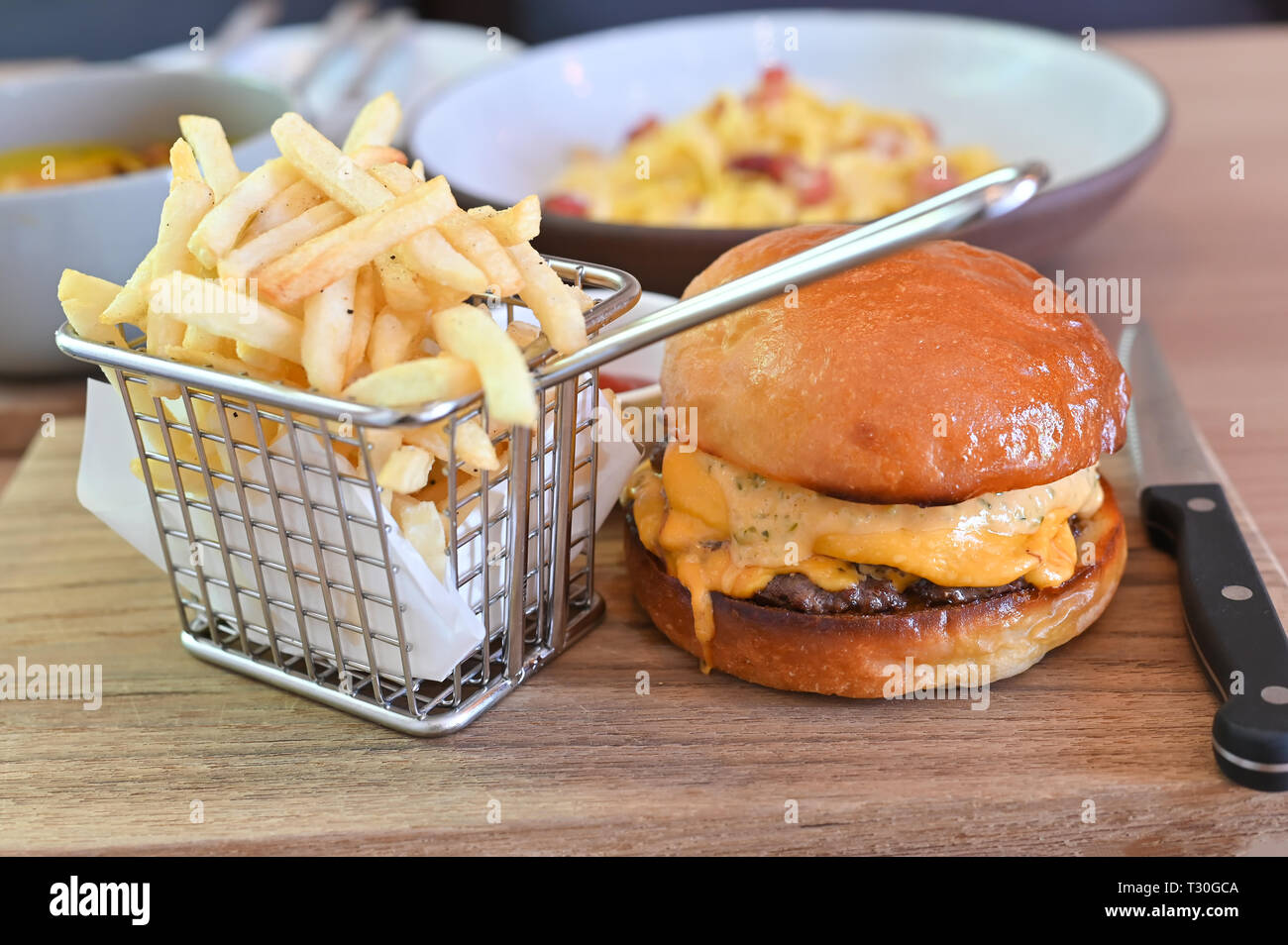 French fries and burger Stock Photo - Alamy