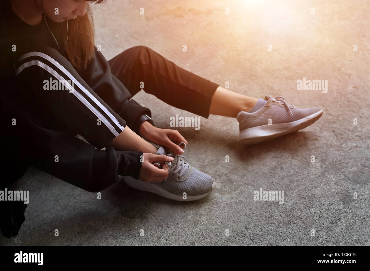 Workout diet concept, Runner trying running shoes get ready for run ...