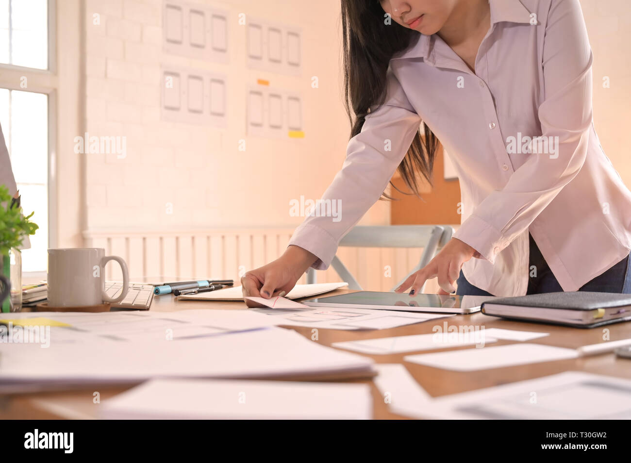 Software developer design a project on paper, UX UI Design concept ...