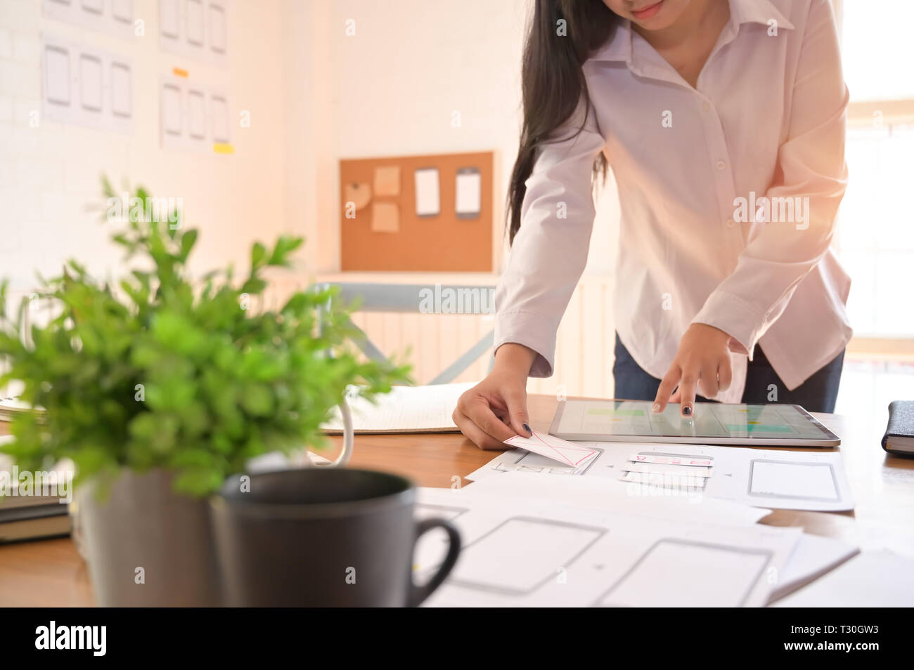 Software developer design a project on paper, UX UI Design concept ...