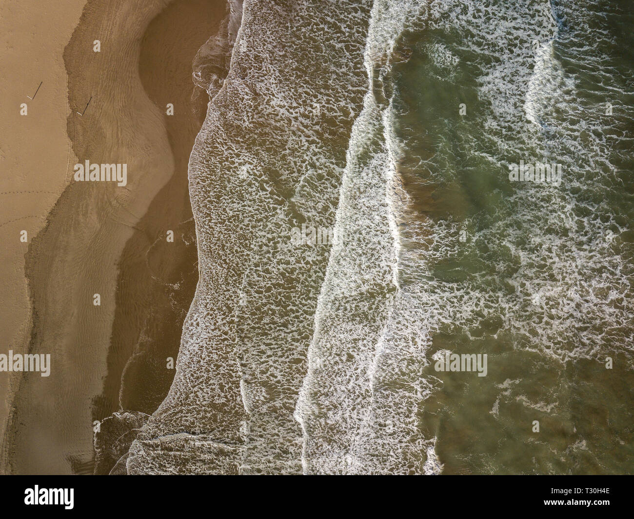 Aerial top down view of beautiful empty beach in Spain Stock Photo - Alamy