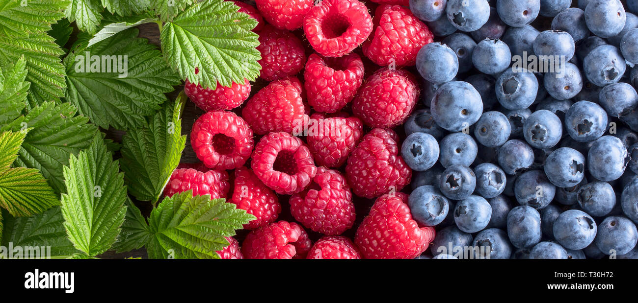 Blueberry and raspberry background. Top view. Ripe and juicy fresh ...