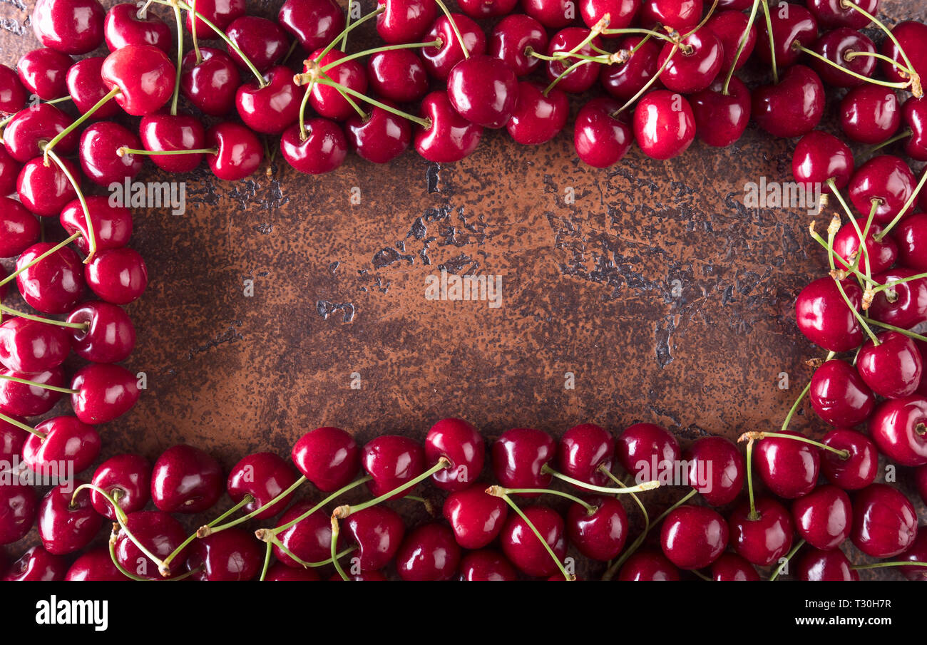 Cherry Background. Cherries on old table. Copy space, top view Stock ...