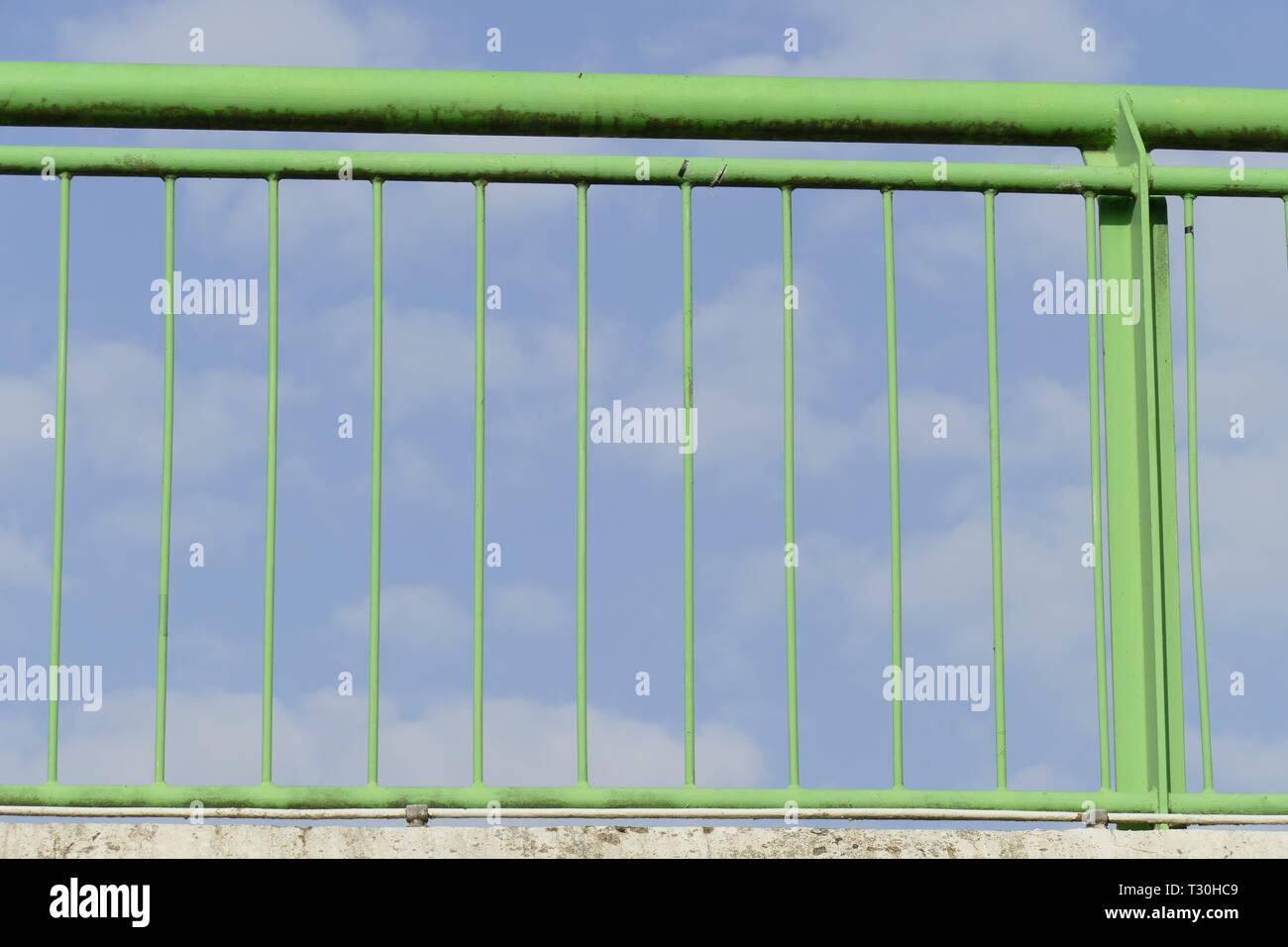 Green railing made of steel Stock Photo - Alamy