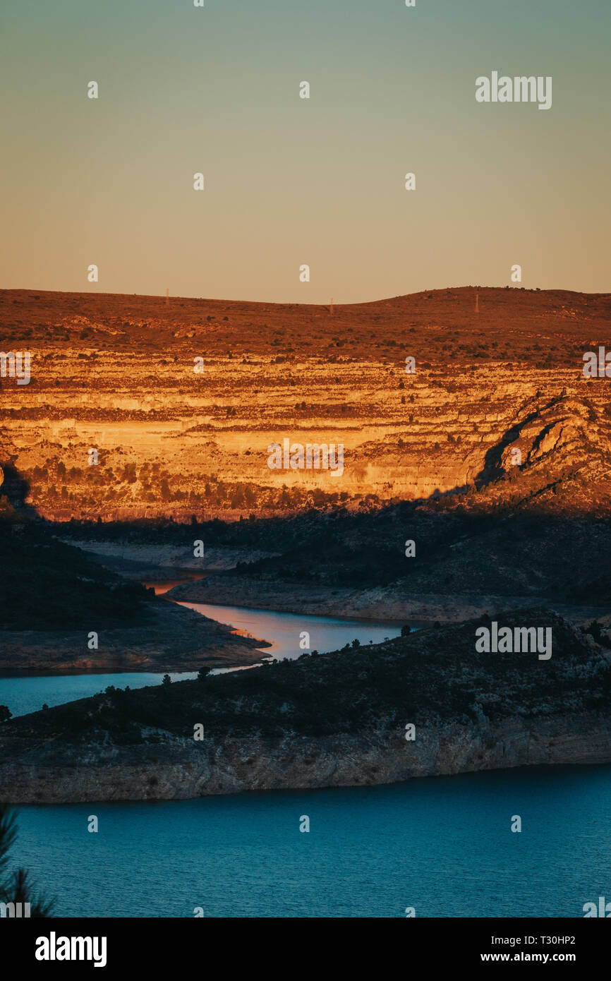 Beautiful sunrise scenery of mountains in Tous, Spain with river in ...