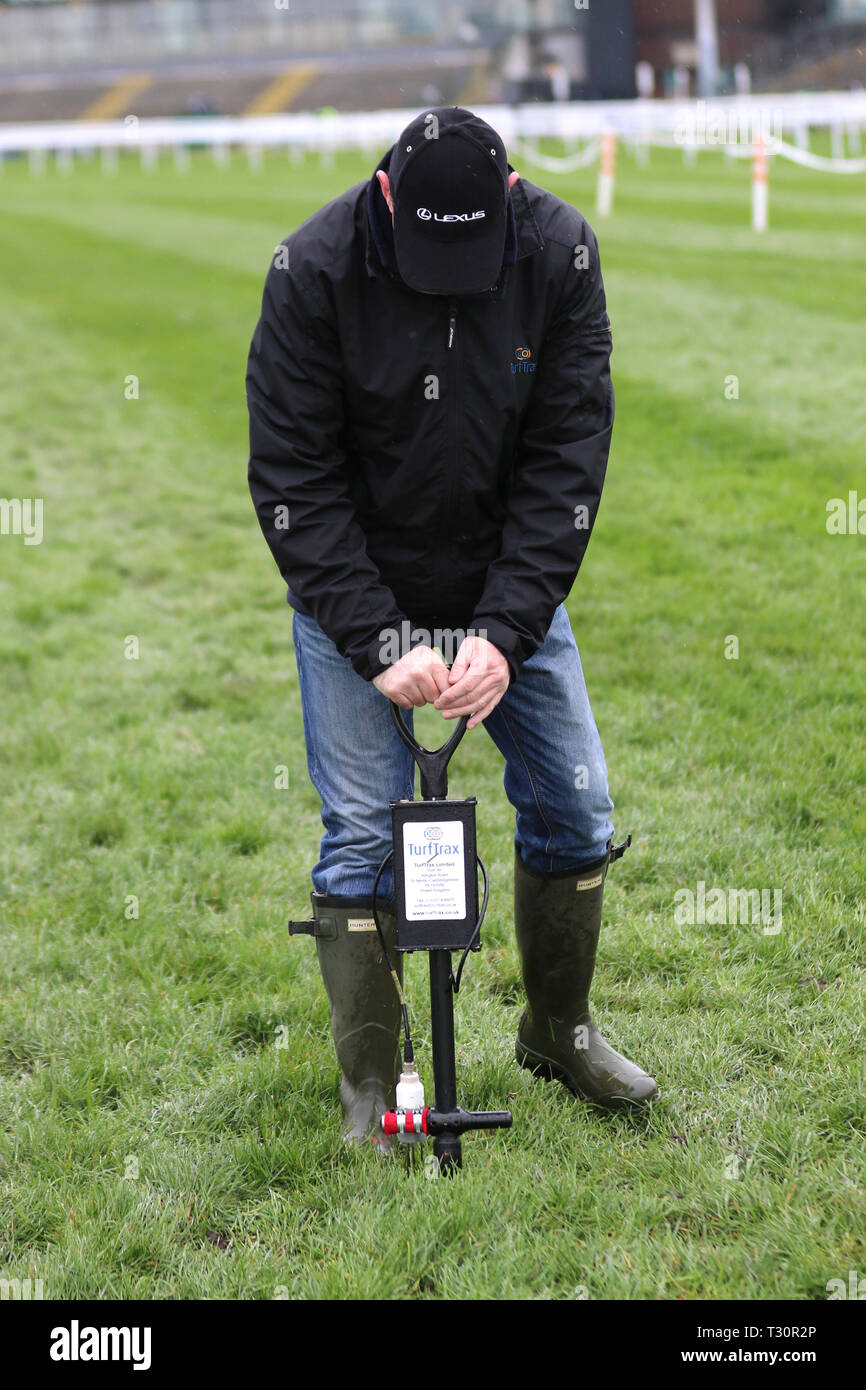 Portrait of Ground Steward using penetrometer at Aintree, Liverpool ...