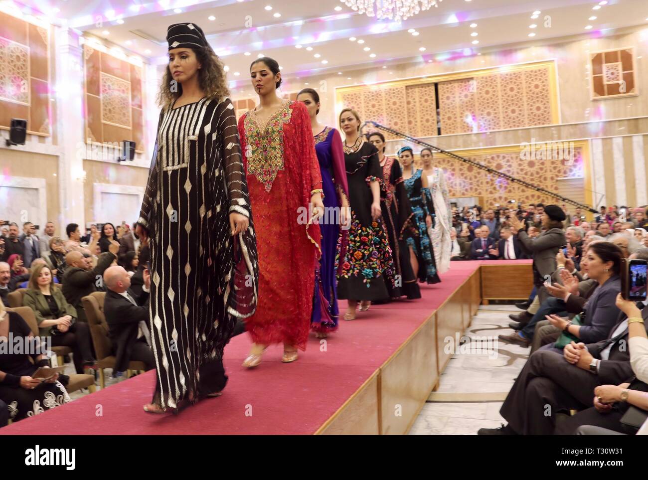 Baghdad, Iraq. 4th Apr, 2019. Models present creations by Iraqi ...