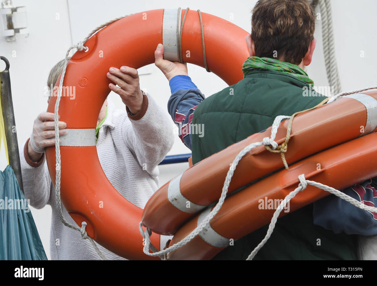 Greifswald Wieck, Germany. 06th Apr, 2019. Sailors bring life rings to ...
