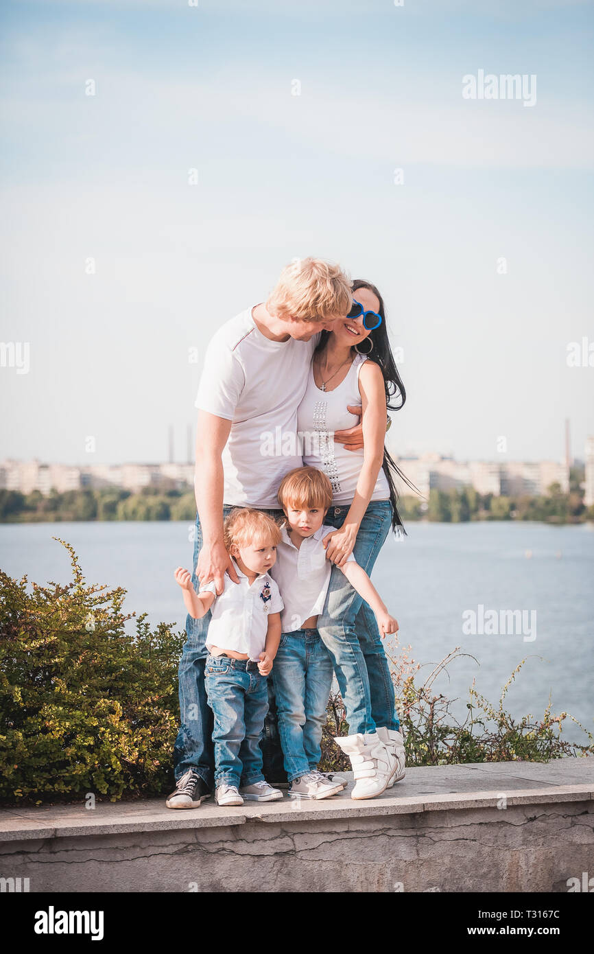 Happy family together against beautiful background Stock Photo - Alamy