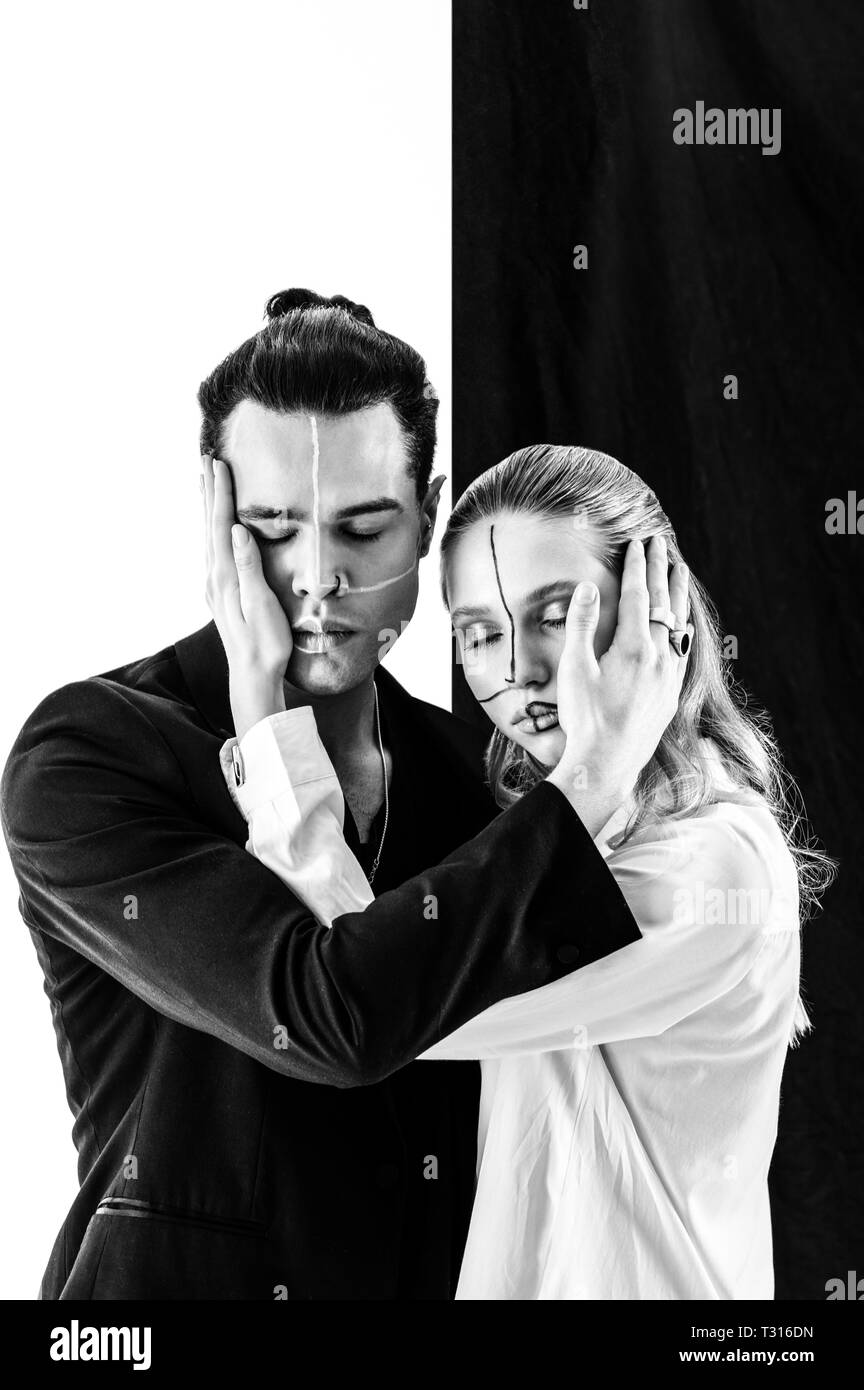 Black or white. Professional good-looking young models posing for black ...