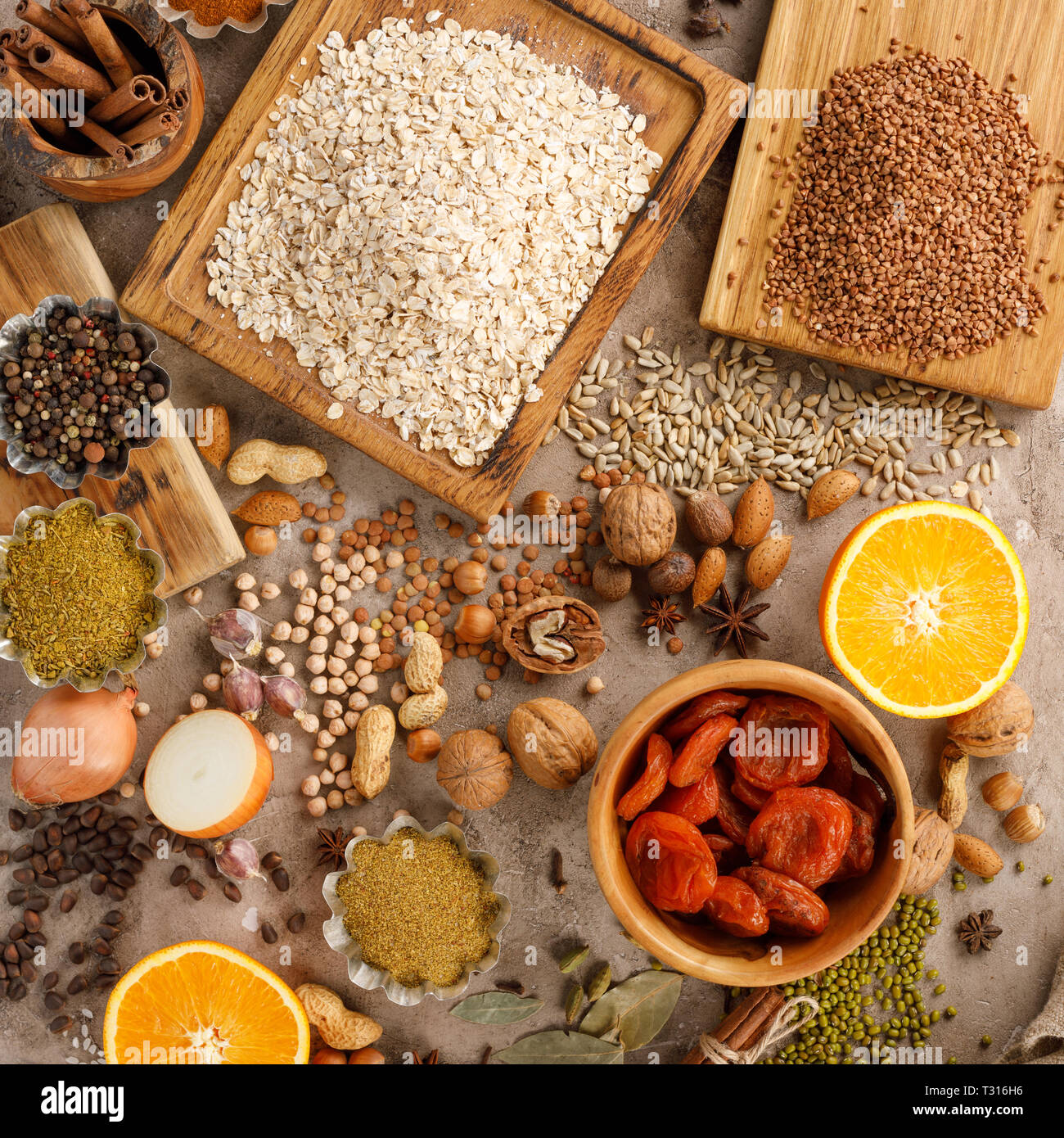 Dried fruits cereals spices and nuts organic healthy snacks on a ...