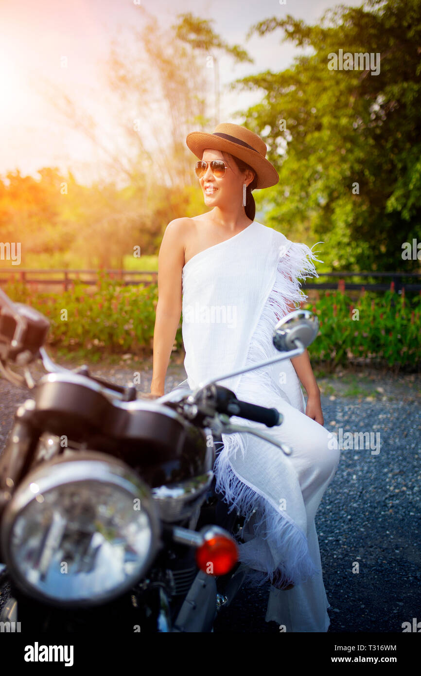 beautiful asian younger woman riding on vintage motorcycle Stock Photo ...